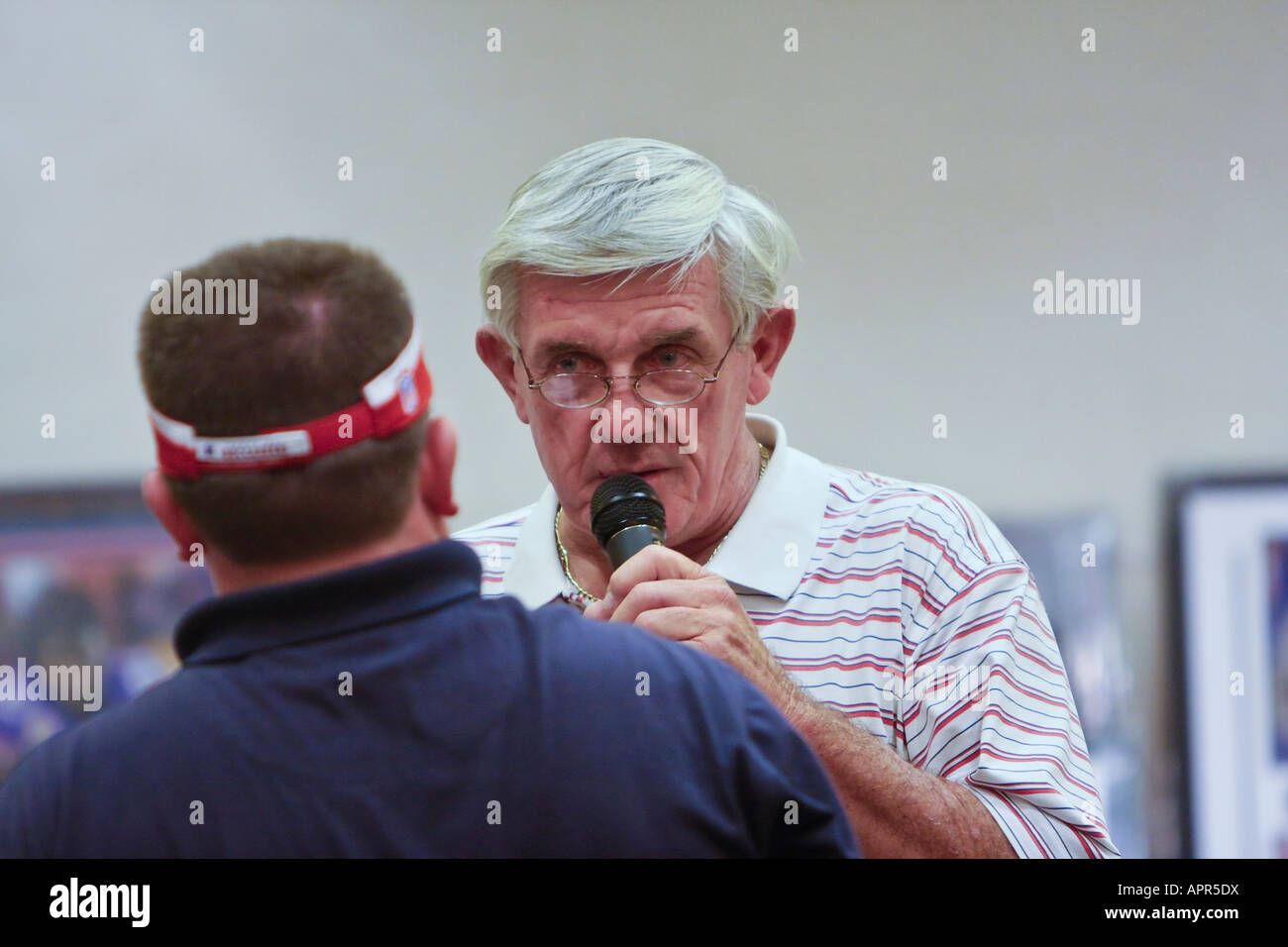 Man with a Microphone Making an Announcement Stock Photo - Alamy