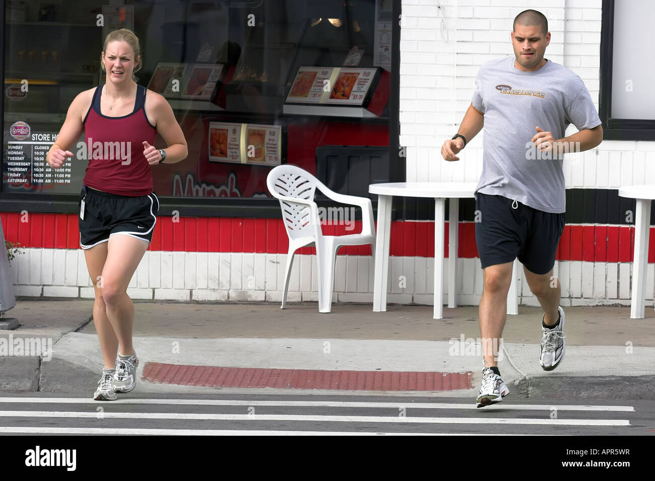 Male and female running Stock Photo - Alamy