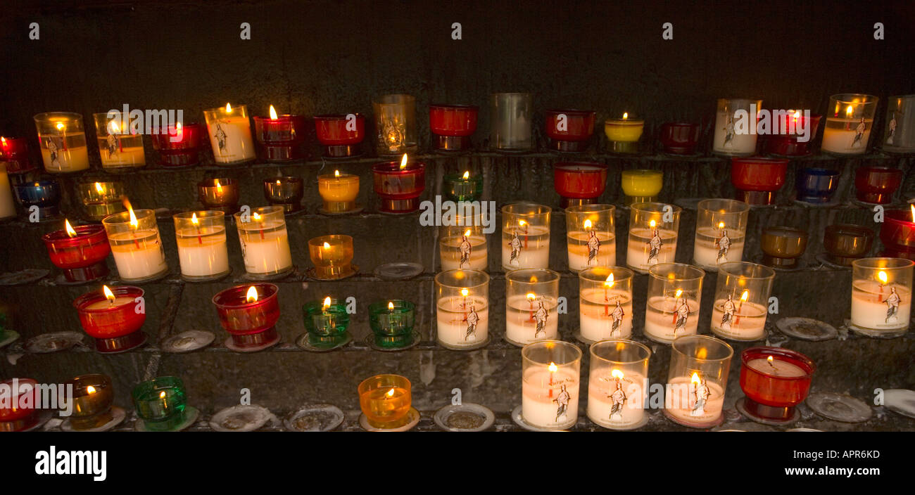 Candle offerings with prayer at the grotto of La Vierge Noire Réunion ...
