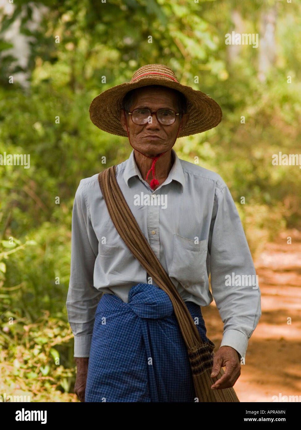 Shan man walking home at Inle Lake in Myanmar Stock Photo - Alamy