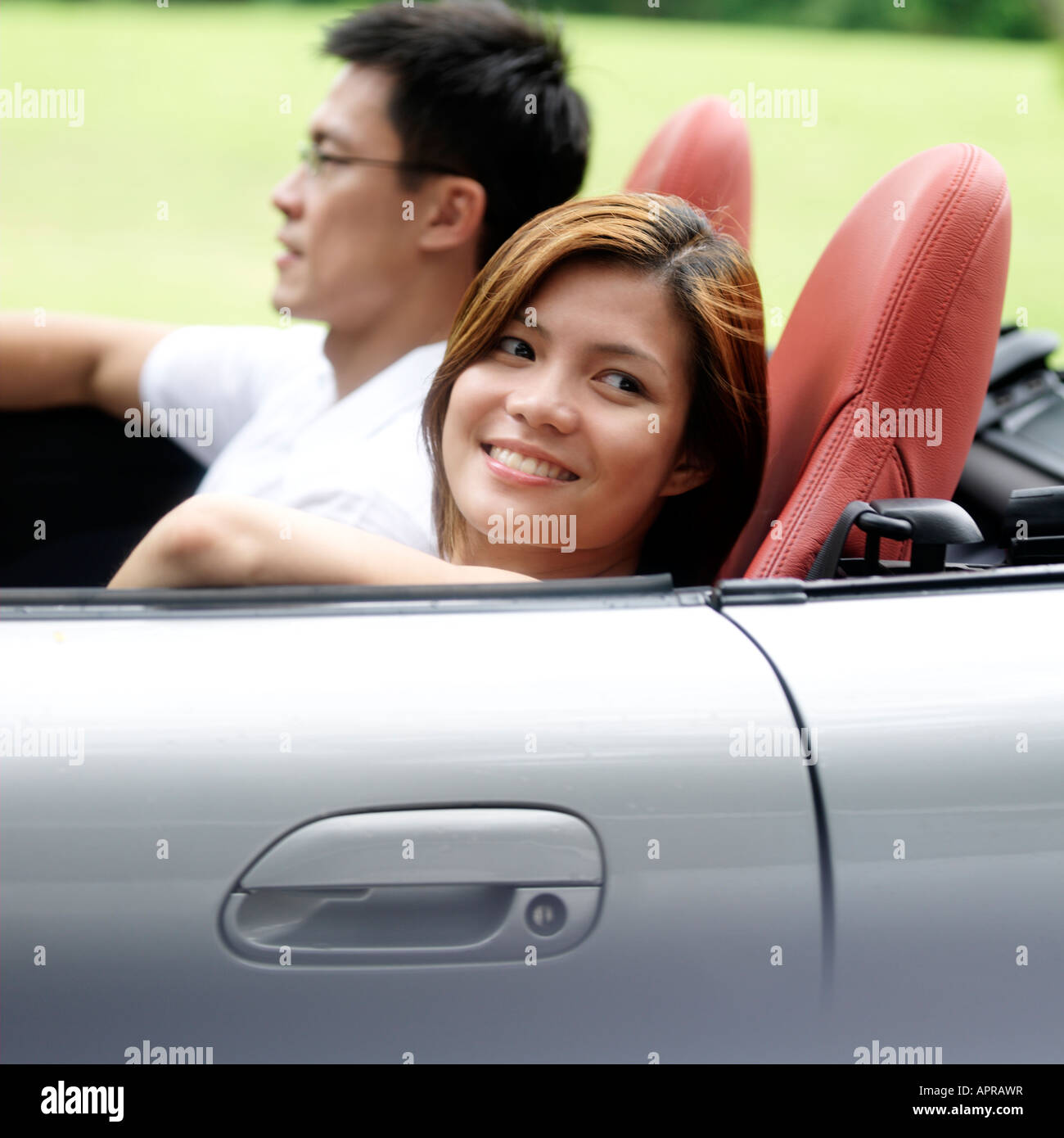 Couple in a convertible Stock Photo - Alamy