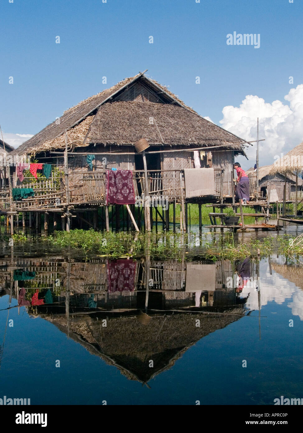 bamboo home on Inle Lake reflected in water Myanmar Stock Photo - Alamy