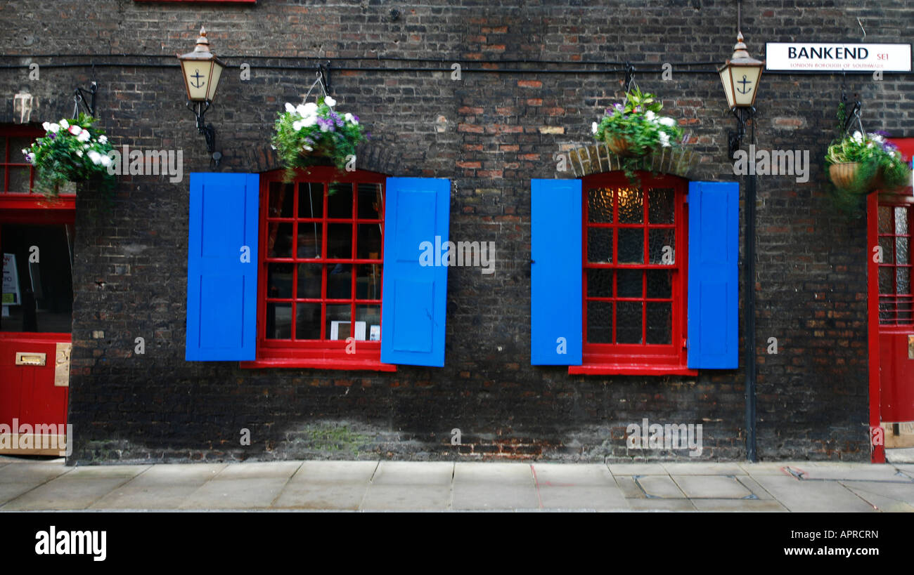 Old english pub with blue window shutters hi-res stock photography and ...