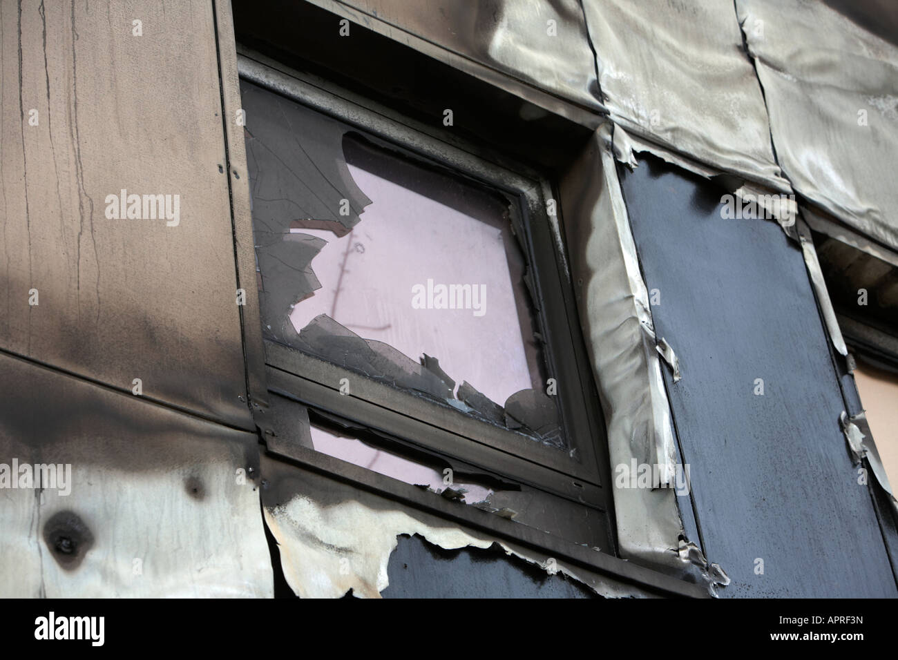fire damaged window and metal panels of shop in city centre Belfast ...