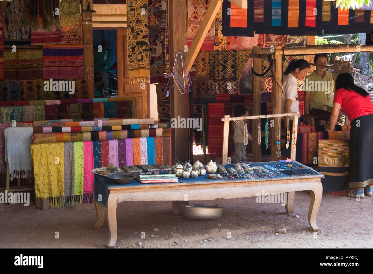 Village Shop Selling Traditional Textiles, Laos, SE Asia Stock Photo ...