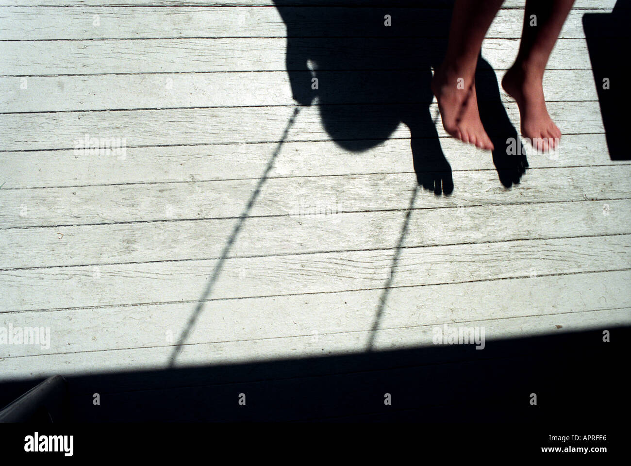Photo by Jeremy Hogan swinging feet shadows mysterious horizontal color ...