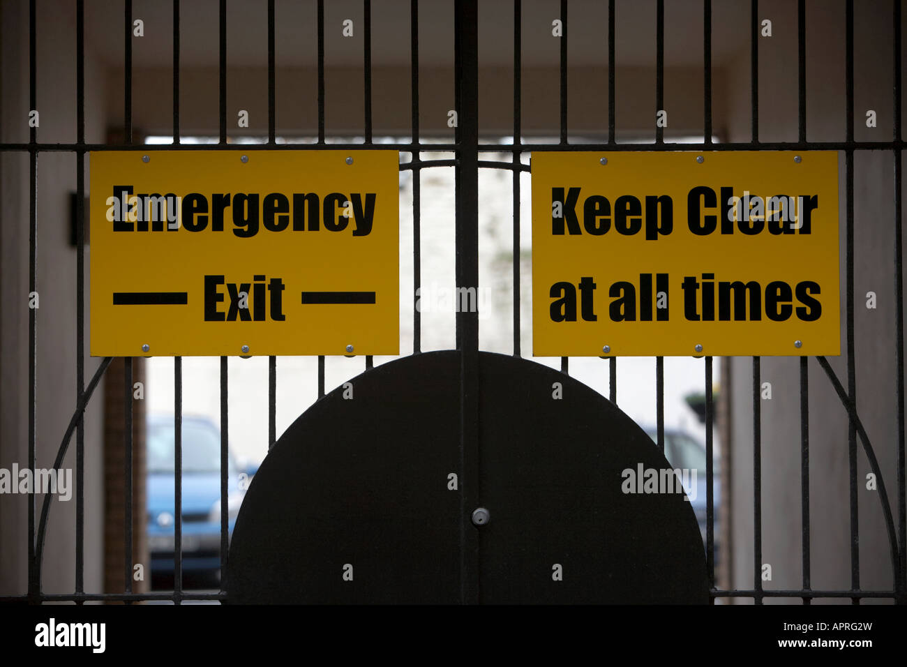 gates to private parking area with emergency exit keep clear at all ...