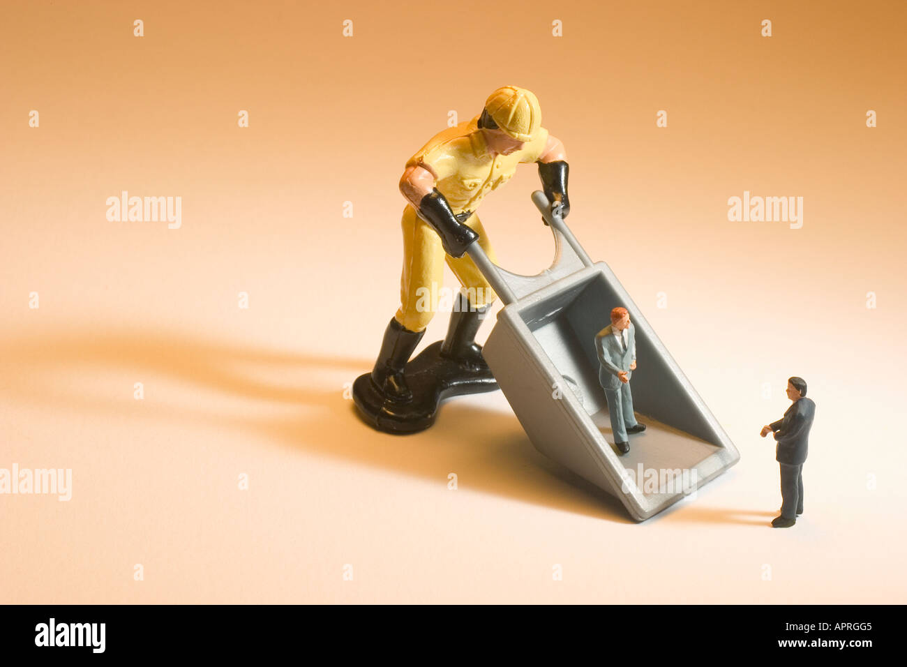 Businessman and Workman Figures Stock Photo - Alamy
