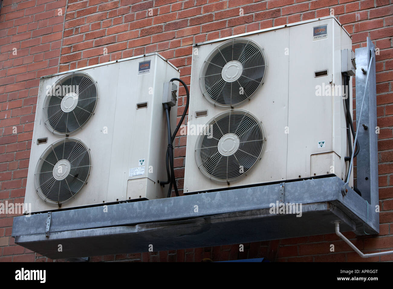 two hitachi supercharge air conditioning units attached to the outside ...