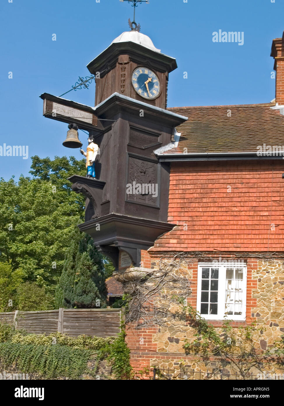 Historic clock overhanging the road at Abinger Hammer Surrey England ...