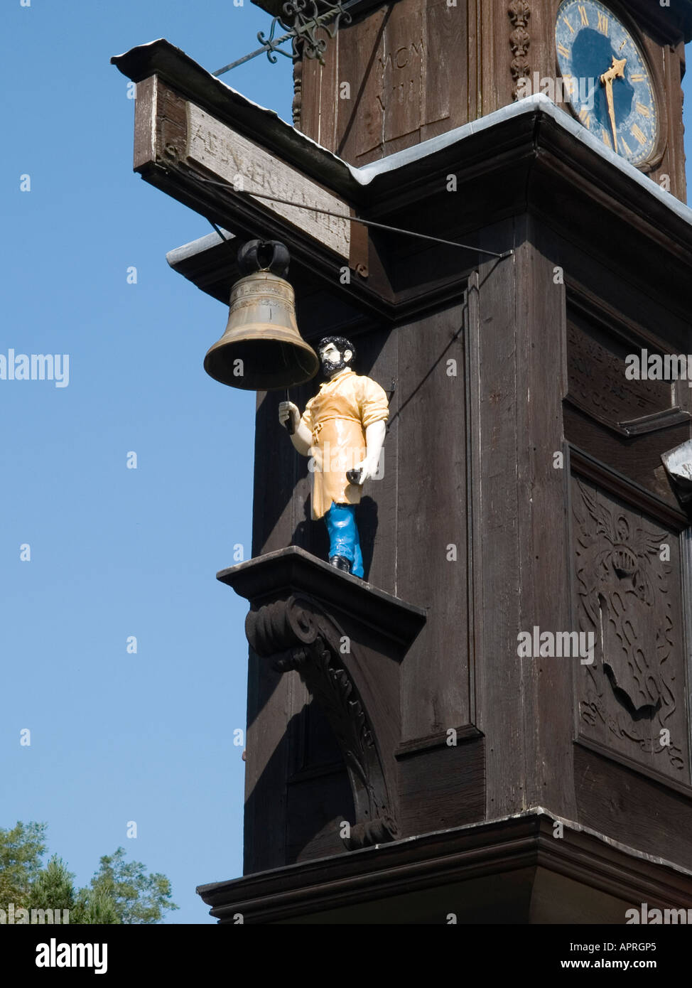 A historic clock overhanging the road at Abinger Hammer Surrey England ...