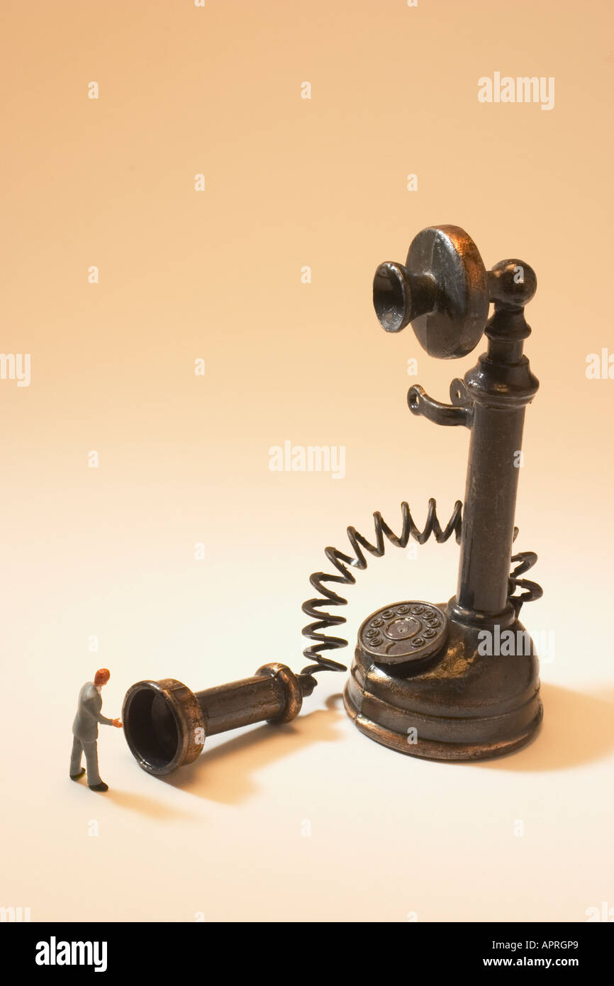 Businessman Figure with Antique Phone Stock Photo - Alamy