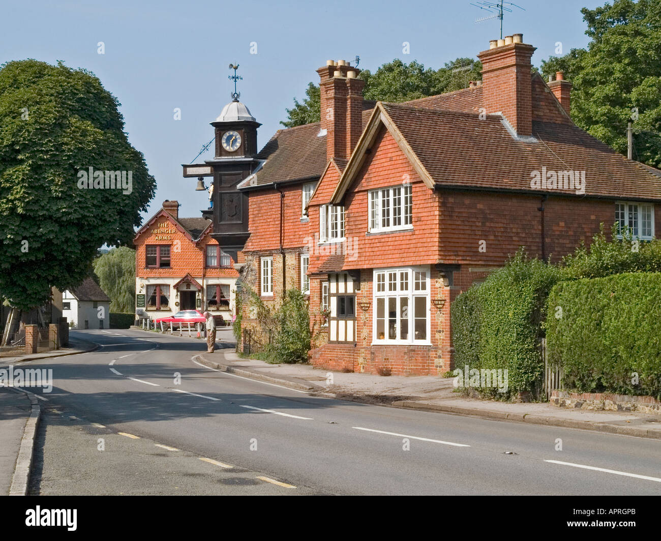 Historic clock overhanging the road at Abinger Hammer Surrey England ...