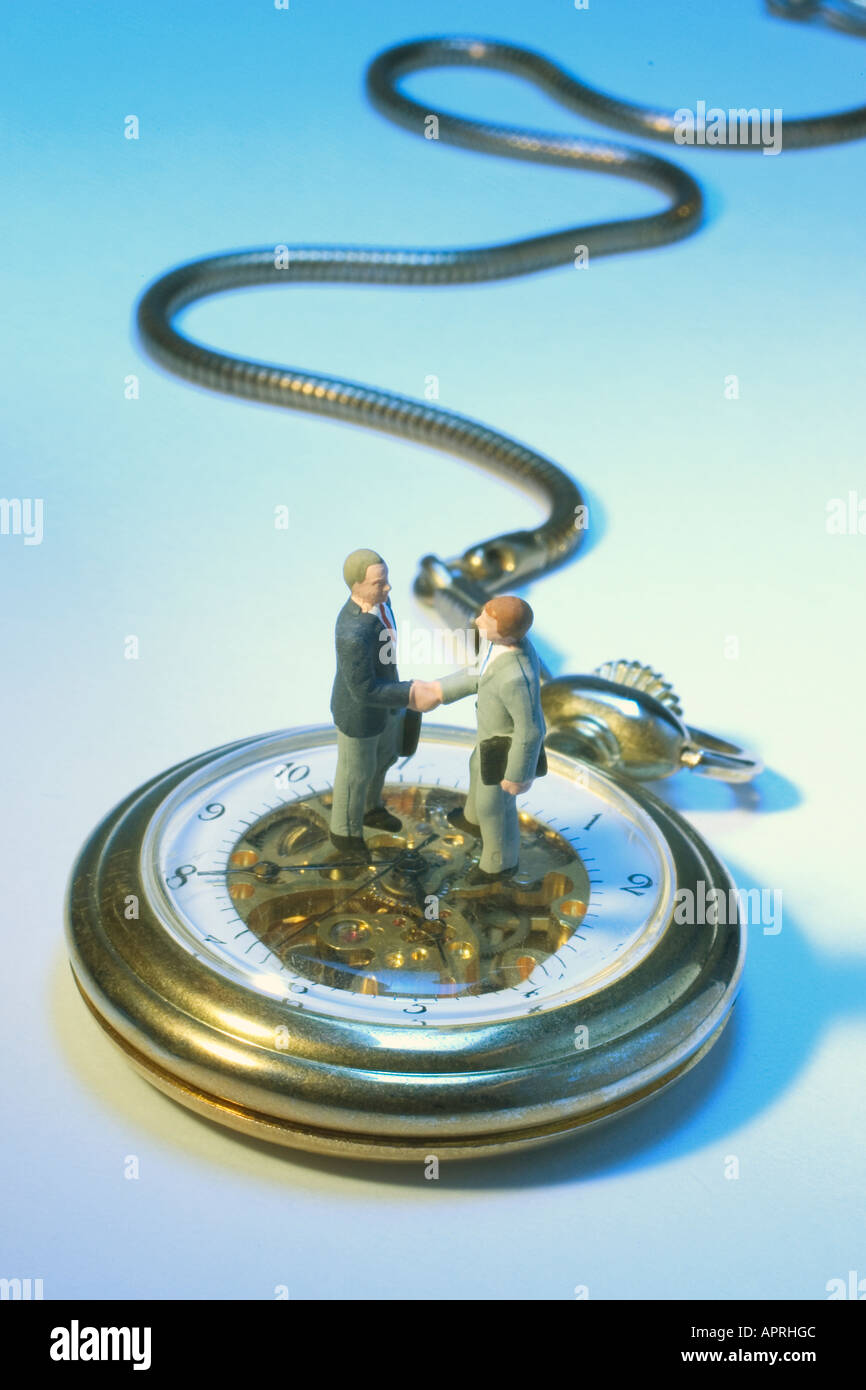 Businessman Figures on Pocket Watch Stock Photo - Alamy