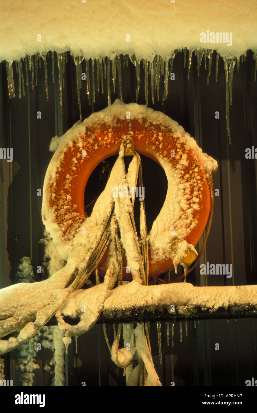 life ring against fish plant with icicles from a winter storm Aleutian ...