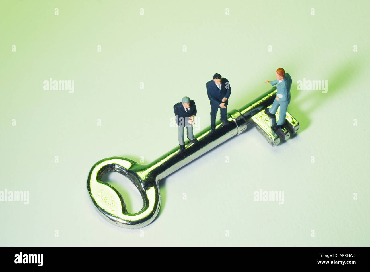 Businessman Figures and Skeleton Key Stock Photo - Alamy
