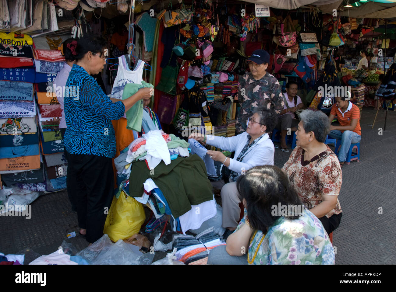 bartering at clothes' stall at Psar Thmei Market (also know as New ...