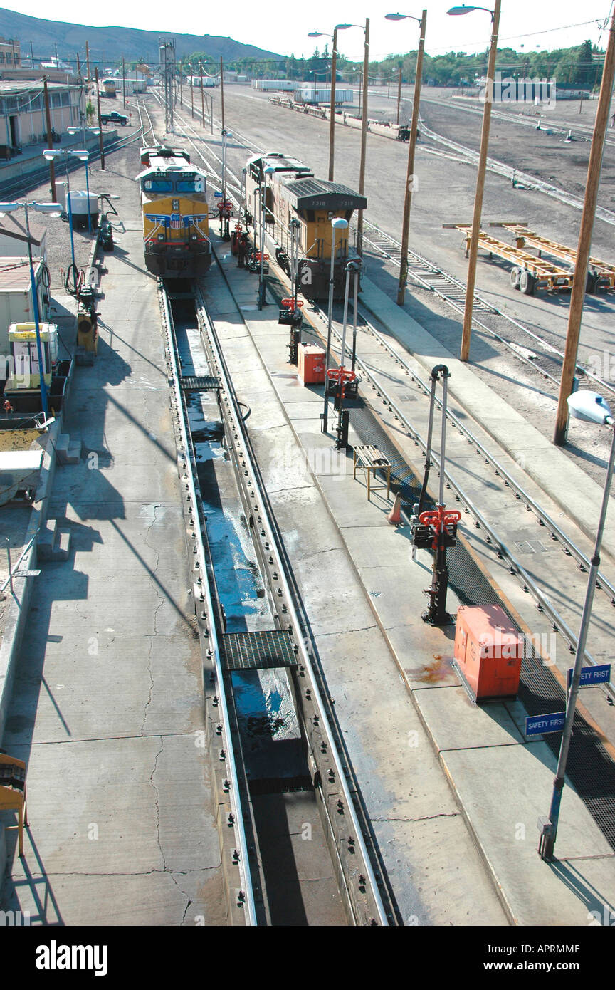 Railroad train switching yard with sidings and switchers and engines ...