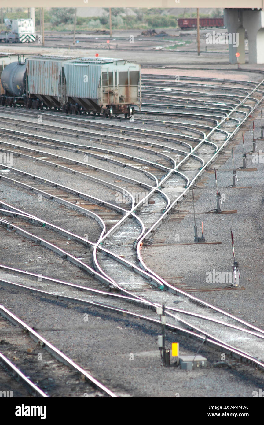 Railroad train switching yard with sidings and switchers and engines ...