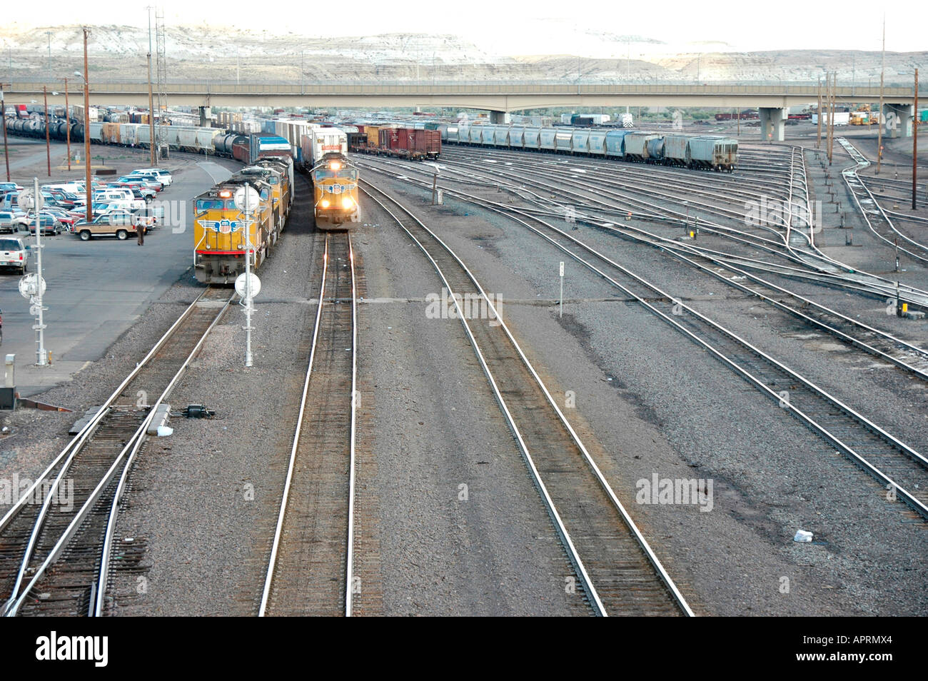 Railroad train switching yard with sidings and switchers and engines ...