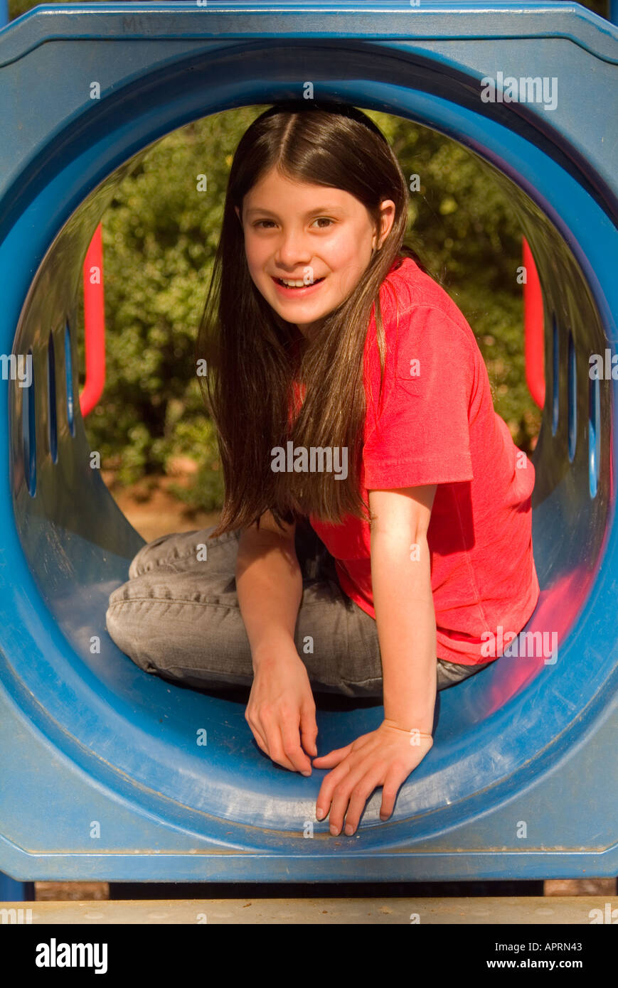 Pretty Young girl on children s playground equipment Stock Photo - Alamy