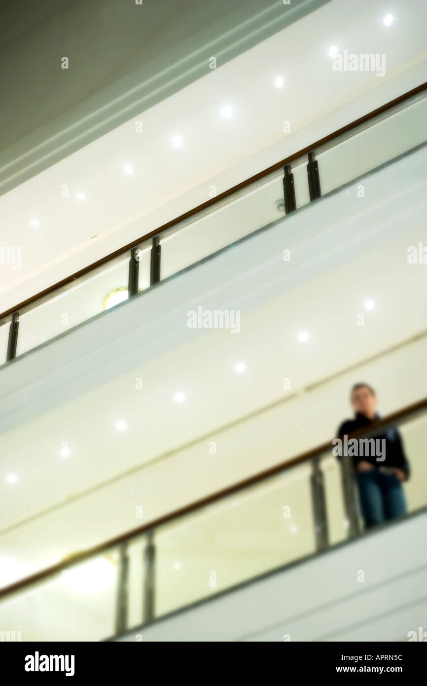 Abstract white balcony inside mall with defocus person Stock Photo - Alamy