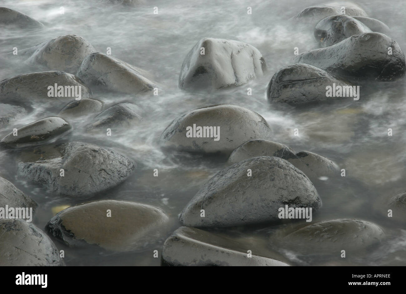 Sea Water around rocks at Dunstanburgh Beach in Northumberland England ...