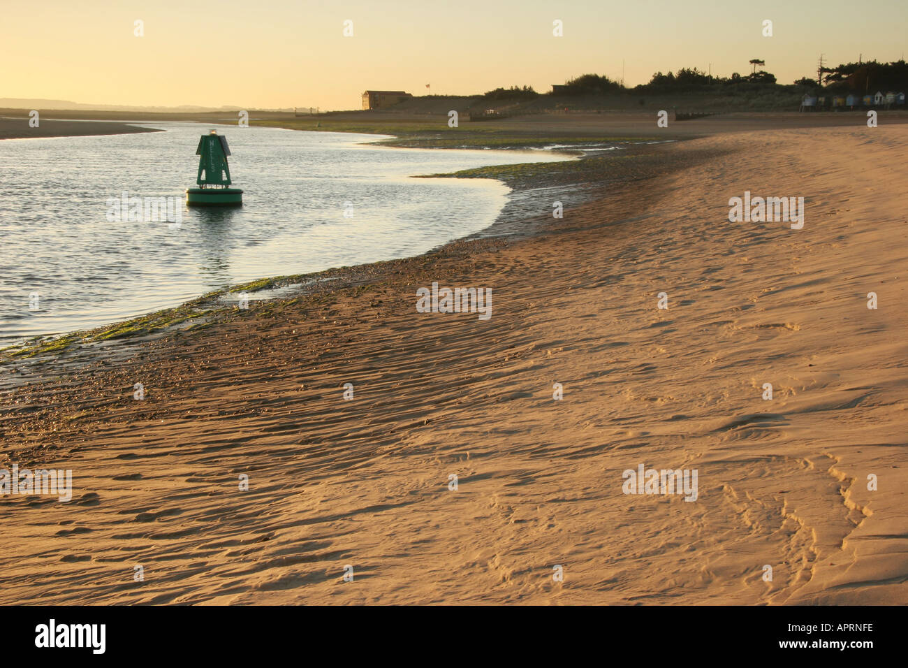 Sea channel and buoy at Wells Beach on the North Norfolk Coast England ...