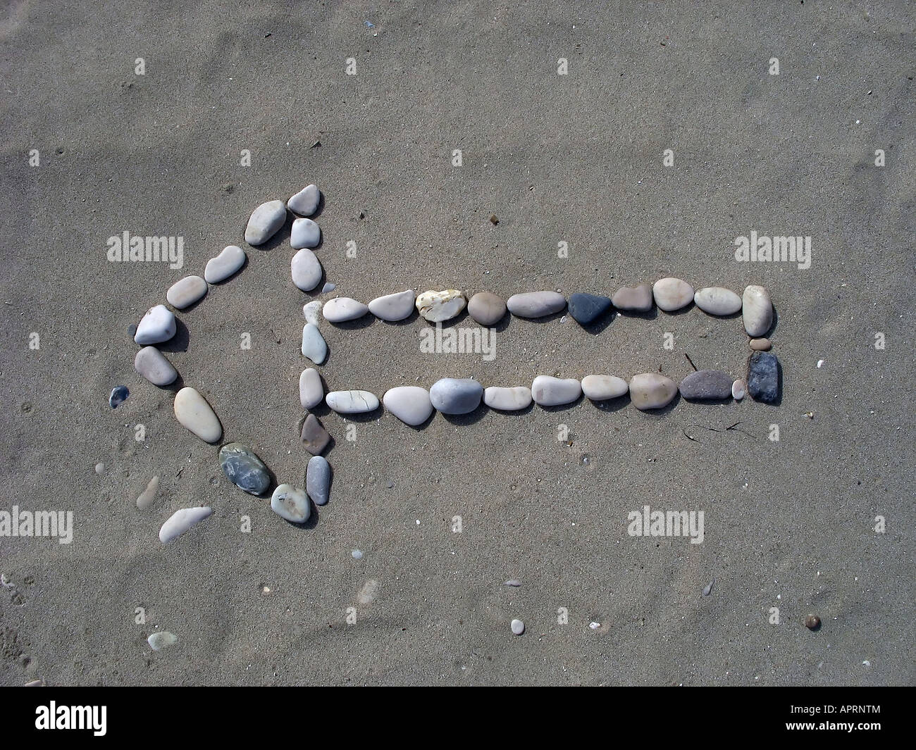 pebble pointer on the beach Stock Photo - Alamy
