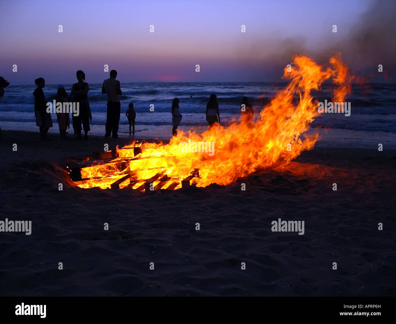 fire sunset party on the beach Stock Photo - Alamy