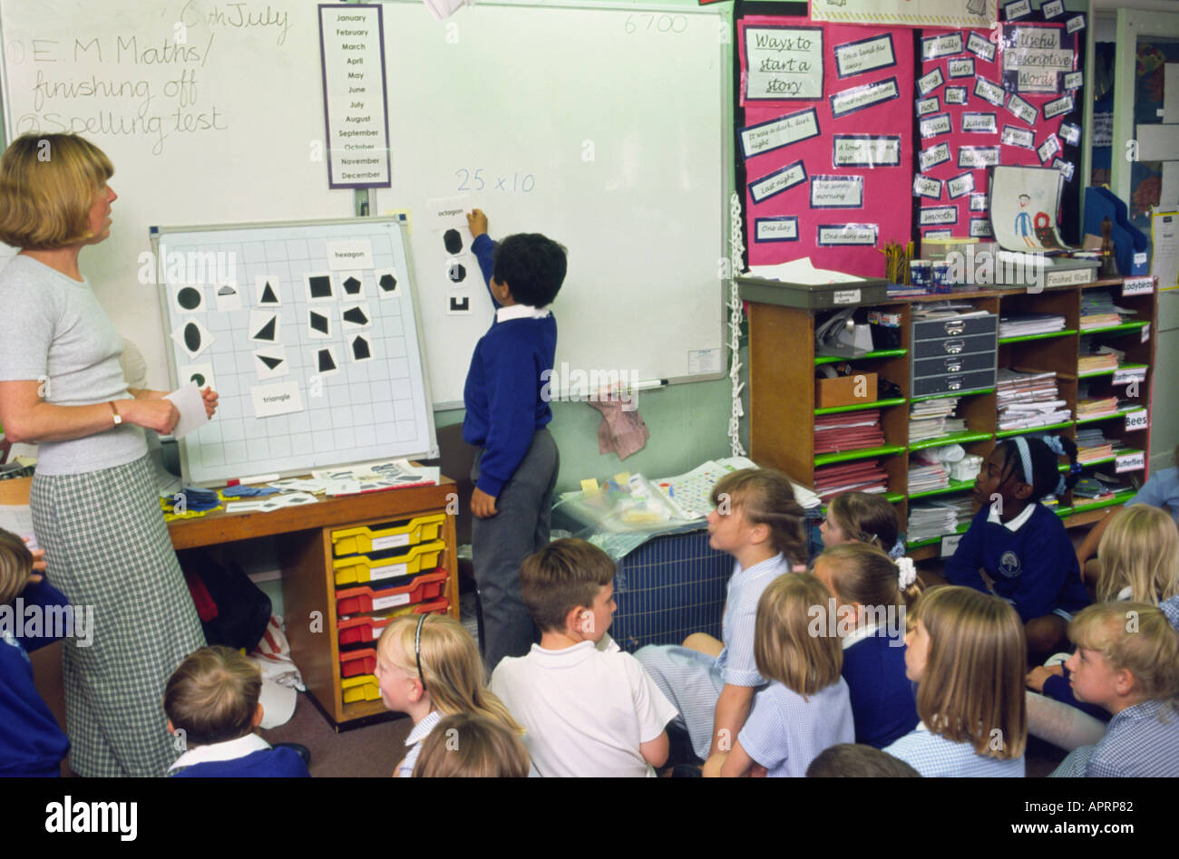 primary classroom wtih teacher Stock Photo - Alamy
