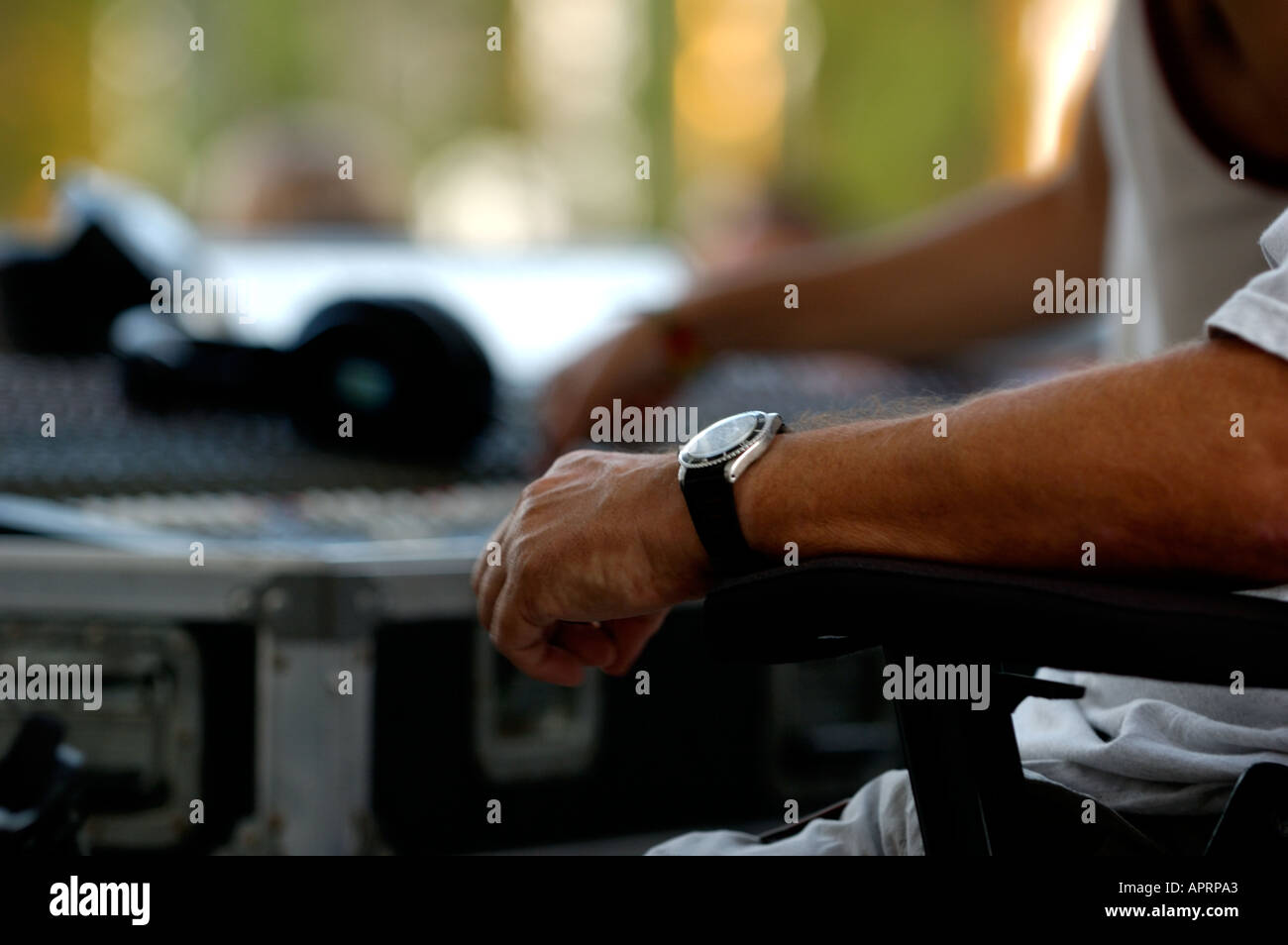 Sound engineer sitting at console in outdoor music concert Stock Photo ...