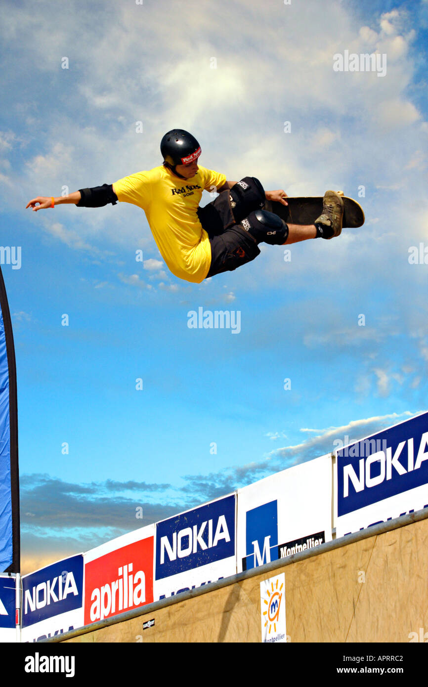 Skate board competitor on half pipe ramp Stock Photo - Alamy