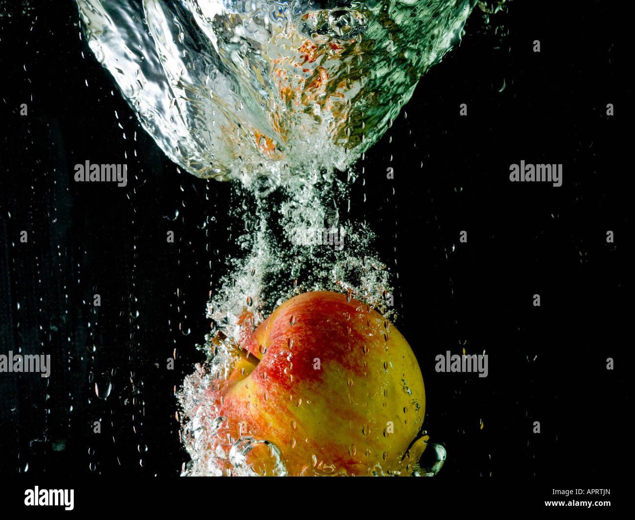 apple falling in the water Stock Photo - Alamy