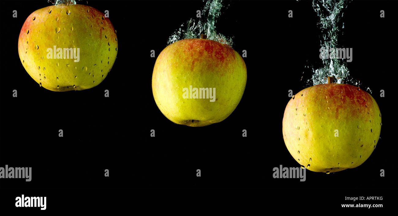 apple falling in the water Stock Photo - Alamy