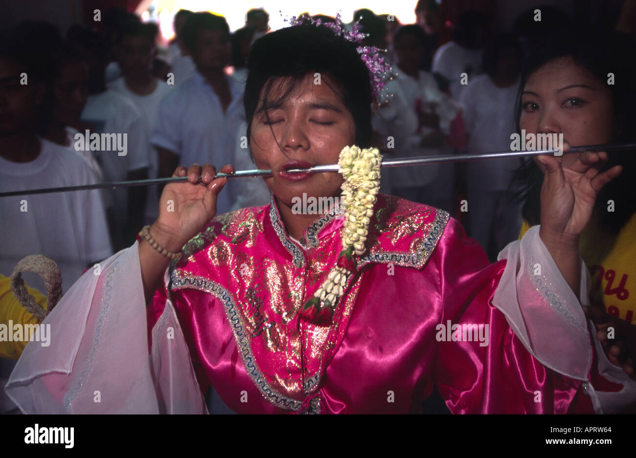 A female spirit medium with pierced cheek during Vegetarian festival in ...