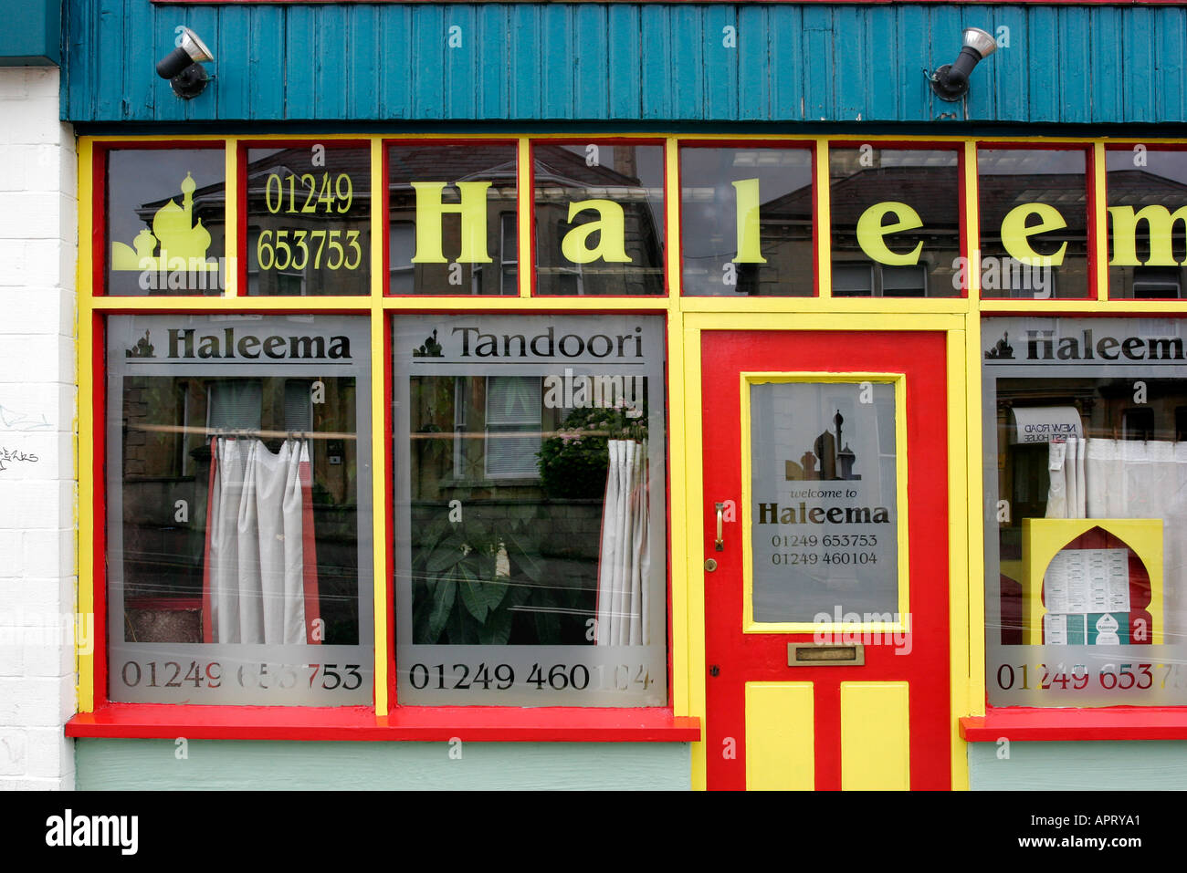 Red door of indian restaurant hi-res stock photography and images - Alamy