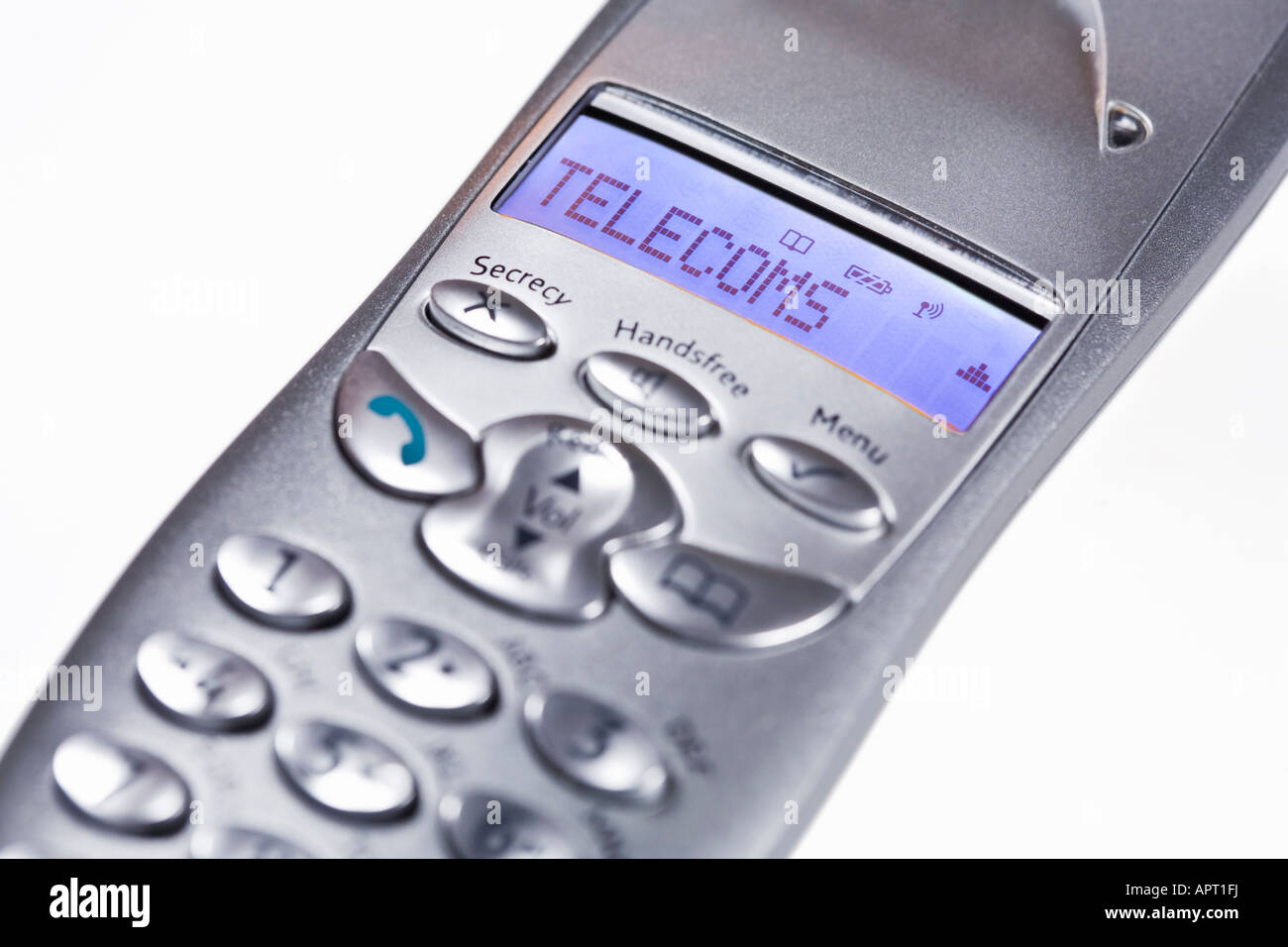 Wireless handheld telephone showing the word telecoms in the main ...