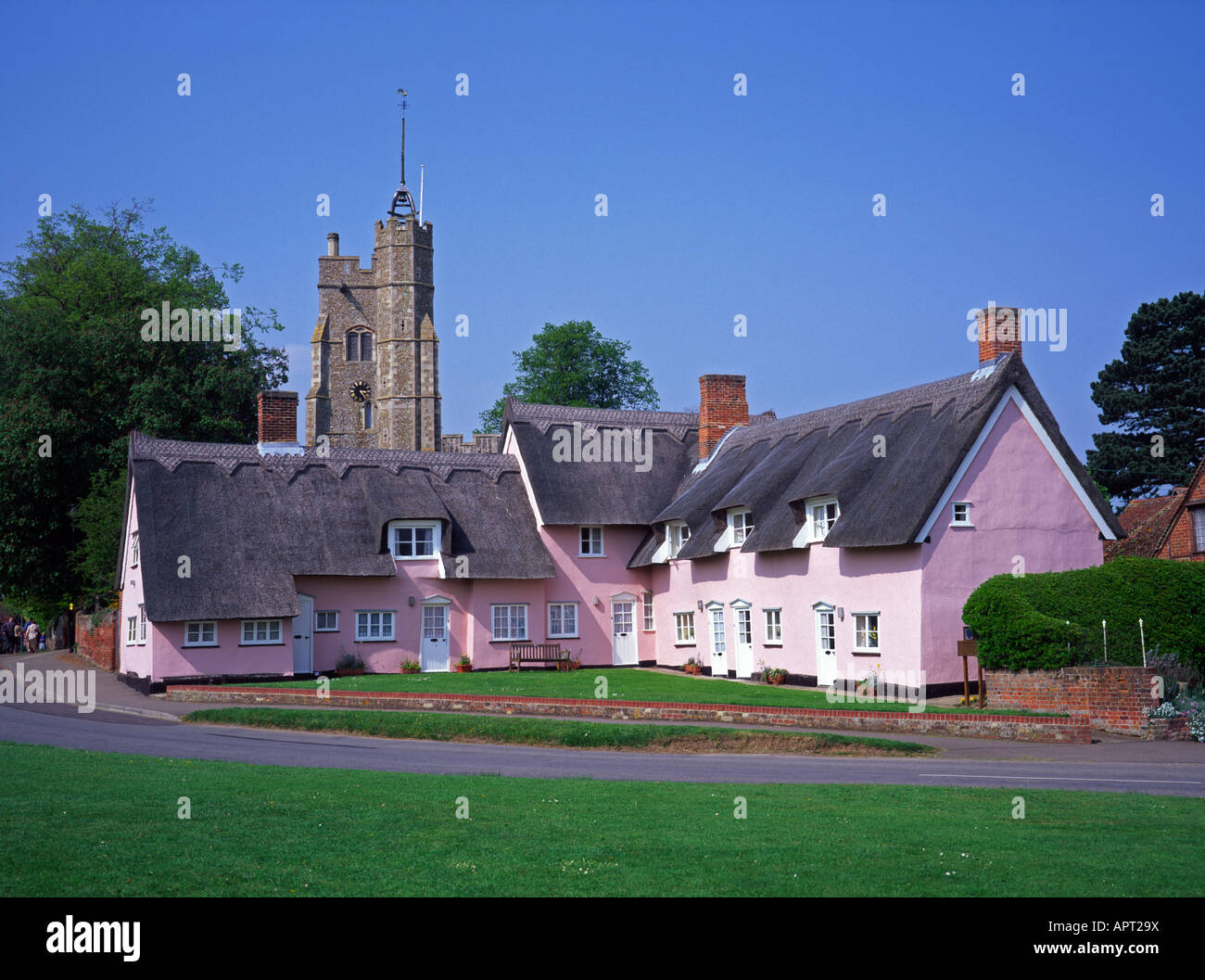 Pink cottages and village church, Cavendish, Suffolk, England Stock ...