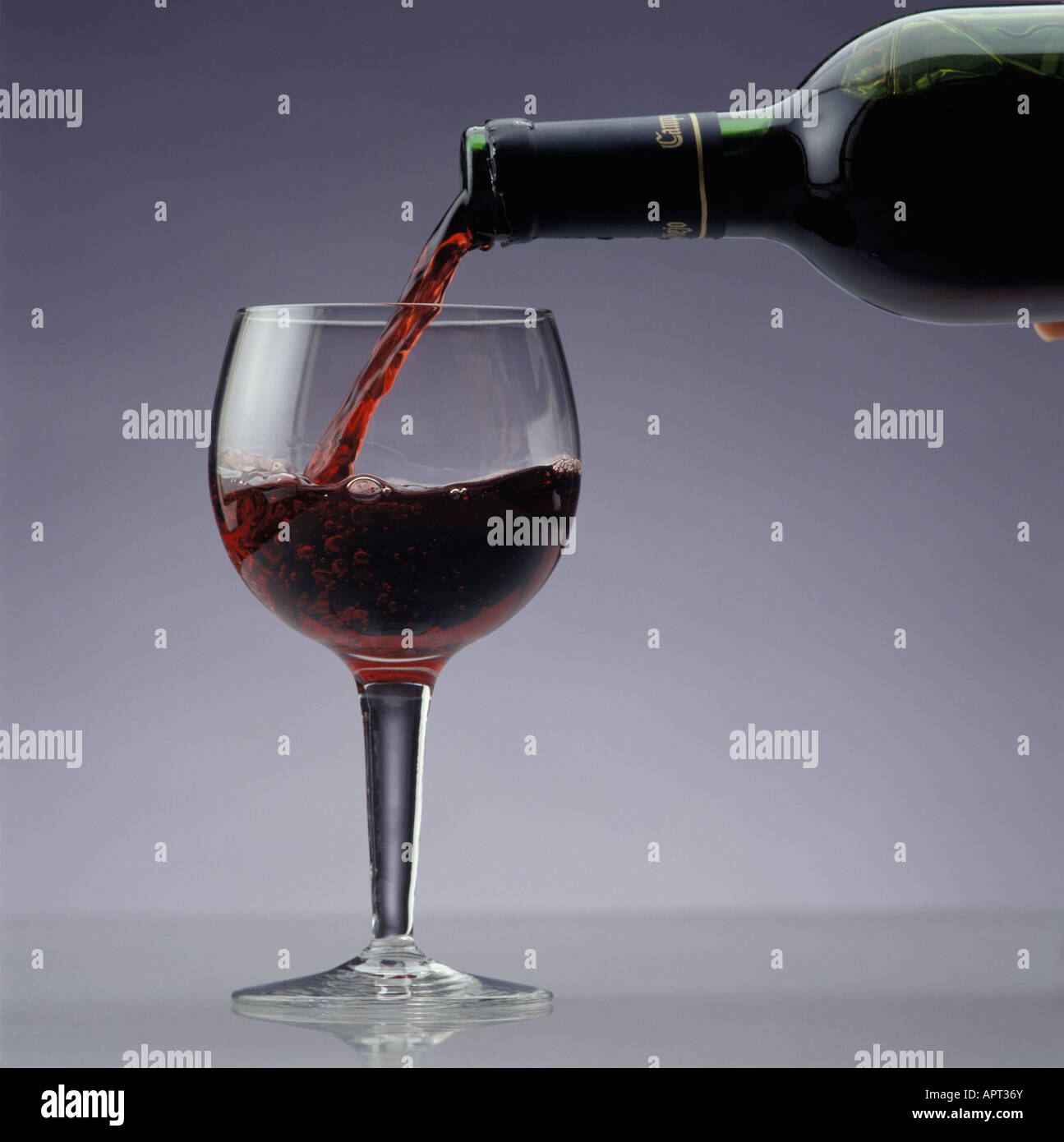 Pouring red wine Stock Photo - Alamy