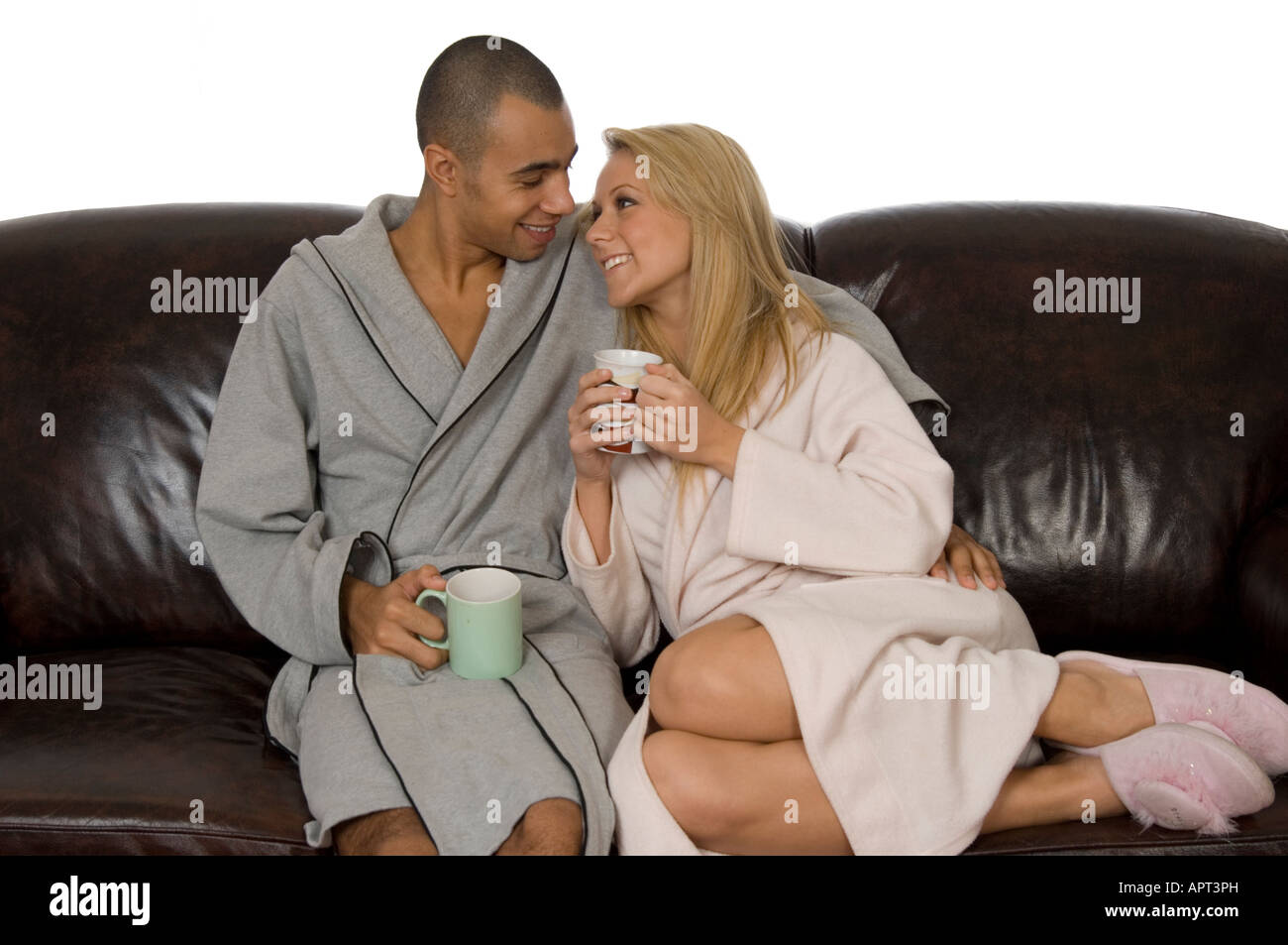 Blonde woman cuddling boyfriend on hi-res stock photography and images ...