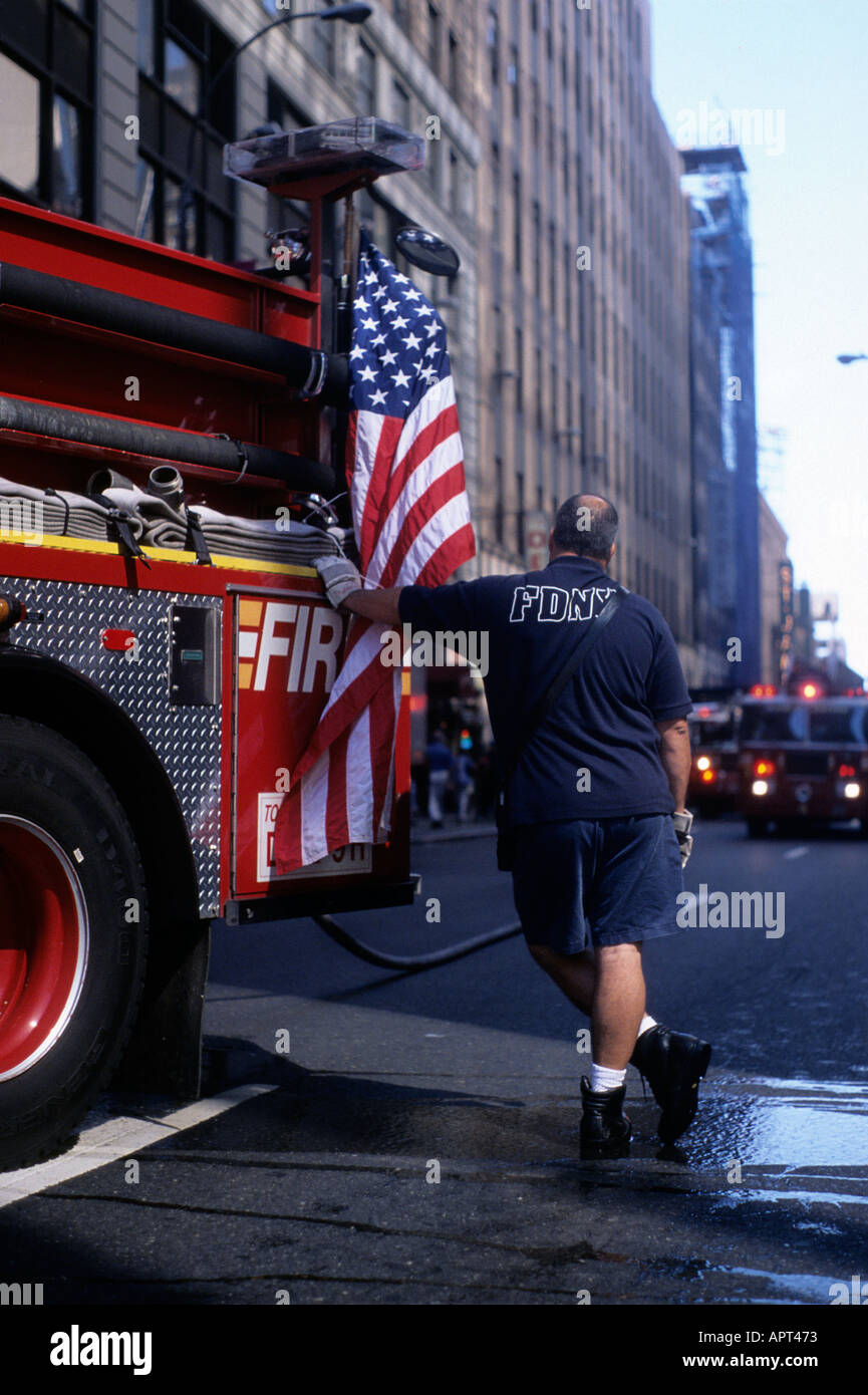 FDNY firefighter stands by fire engine in New York City USA September ...