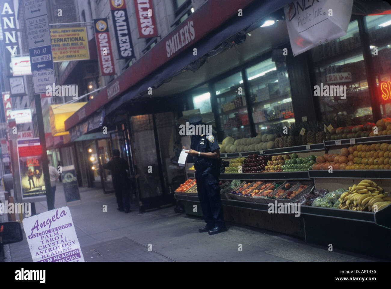 NYPD cop writing out a ticket on a street in New York united States ...