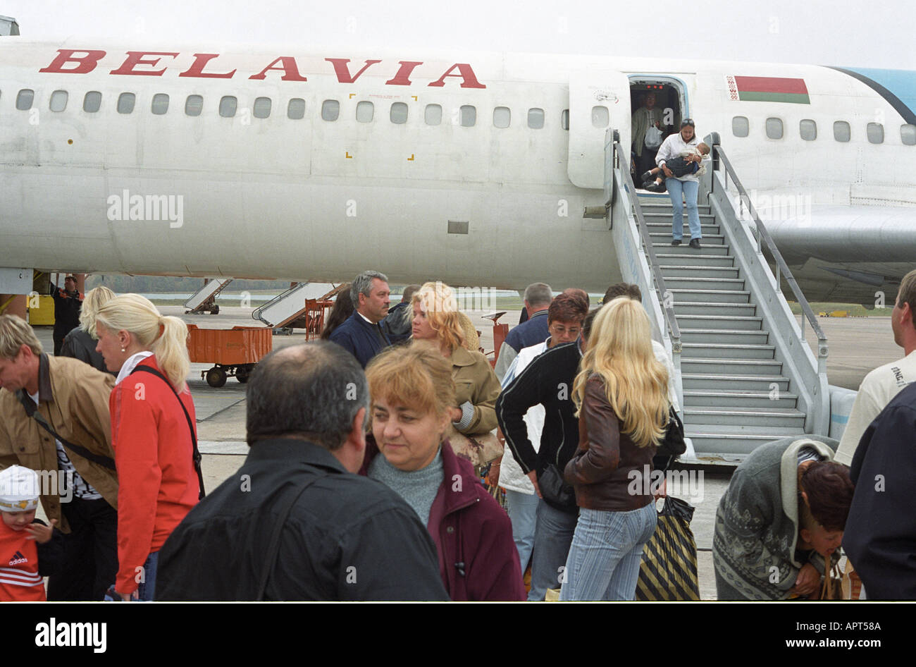 Passengers getting off Belavia airlines flight after vacation to Turkey ...