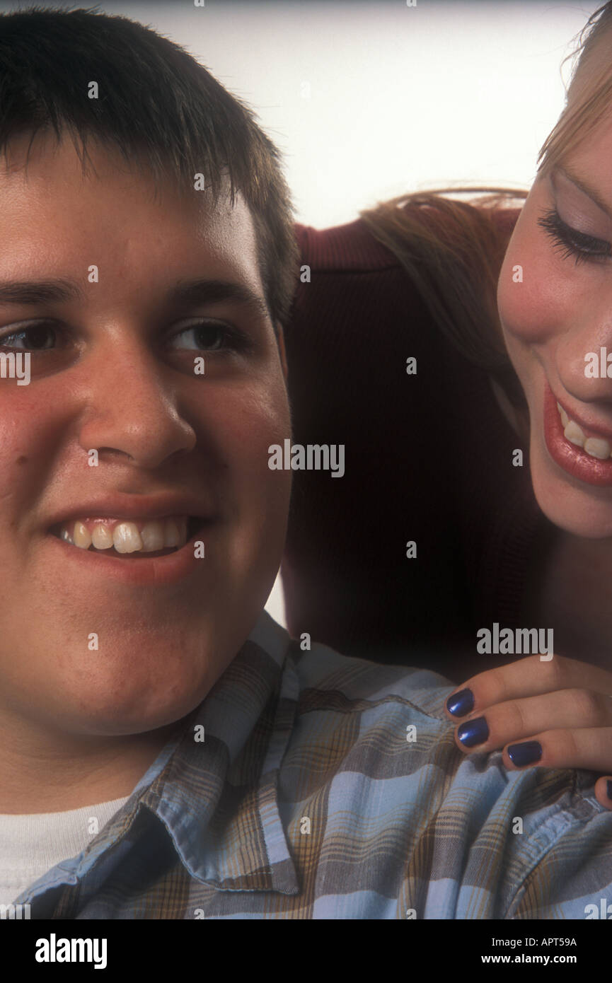 Girl peek over boys shoulder hi-res stock photography and images - Alamy