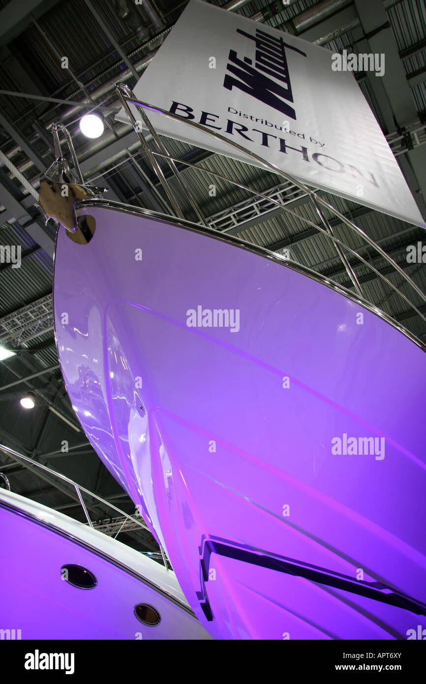 a hull of a large yacht lit from underneath by a purple light London ...