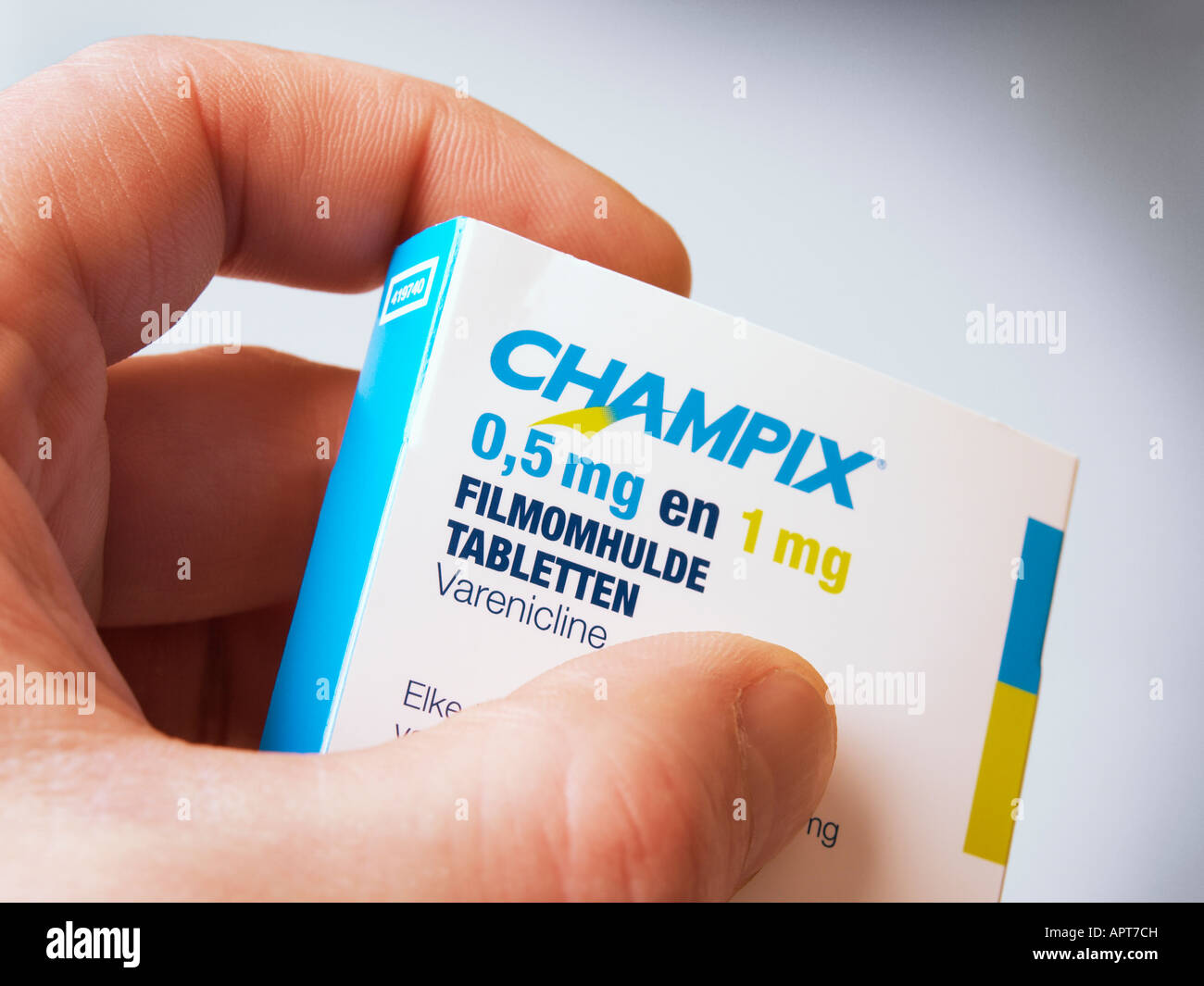 Hand holding pack of Champix by Pfizer a new medicine drug to quit stop ...