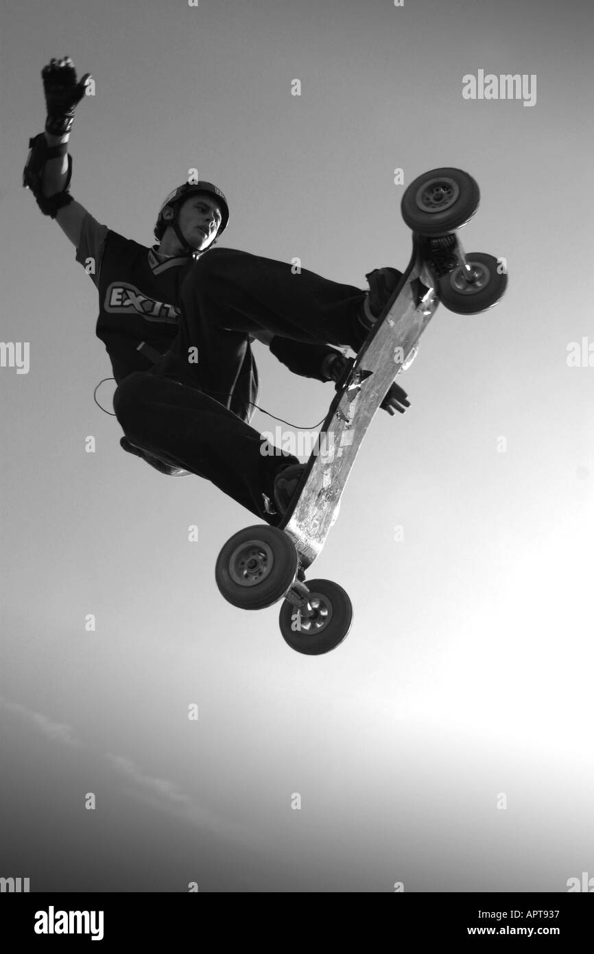 Mountain boarder flying through the air Stock Photo - Alamy