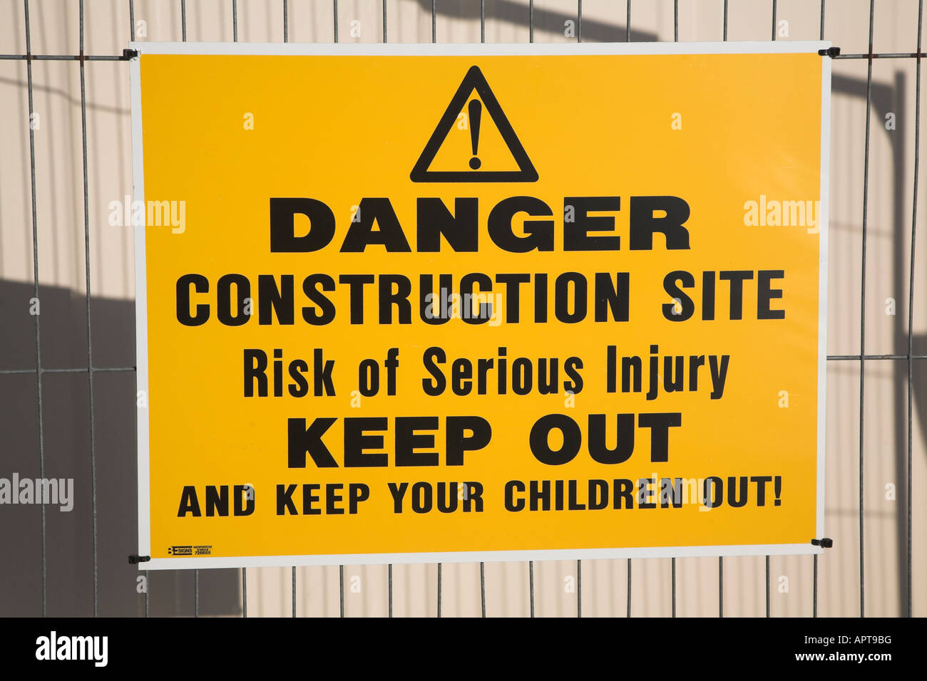 Yellow sign Danger Construction Site Keep Out Stock Photo - Alamy