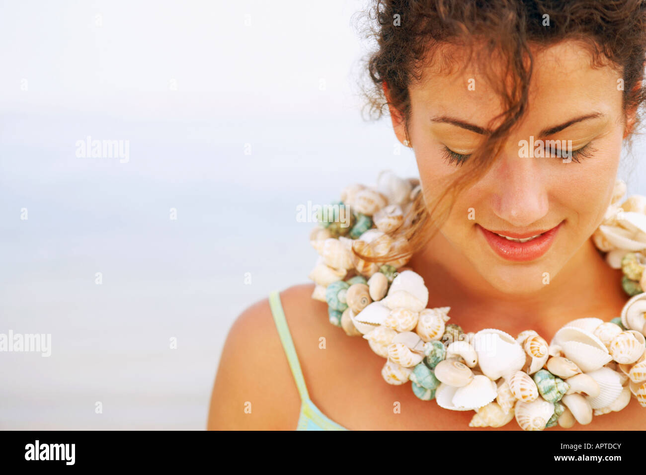 Woman wearing seashell necklace Stock Photo - Alamy